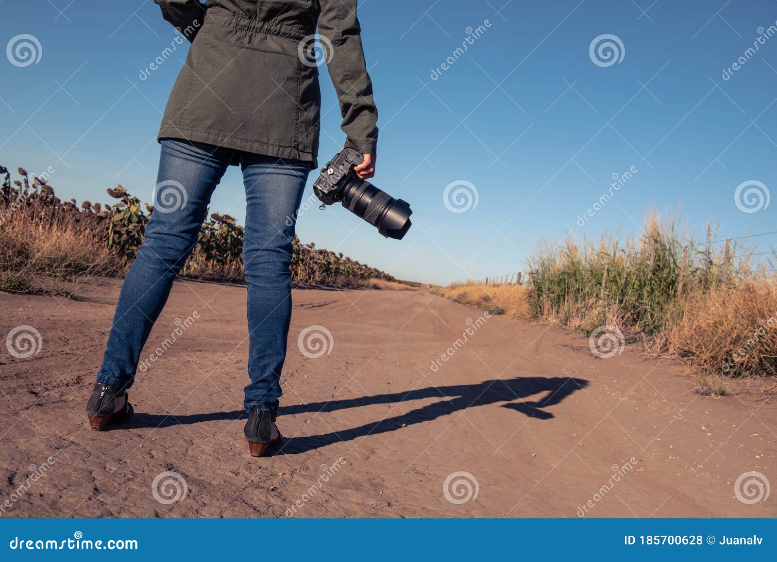 Woman Holding an SLR Camera from Behind Stock Photo - Image of outdoor ...