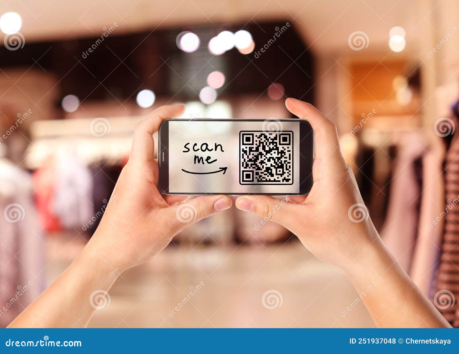 Woman Holding Smartphone with QR Code on Screen in Store Stock Photo ...