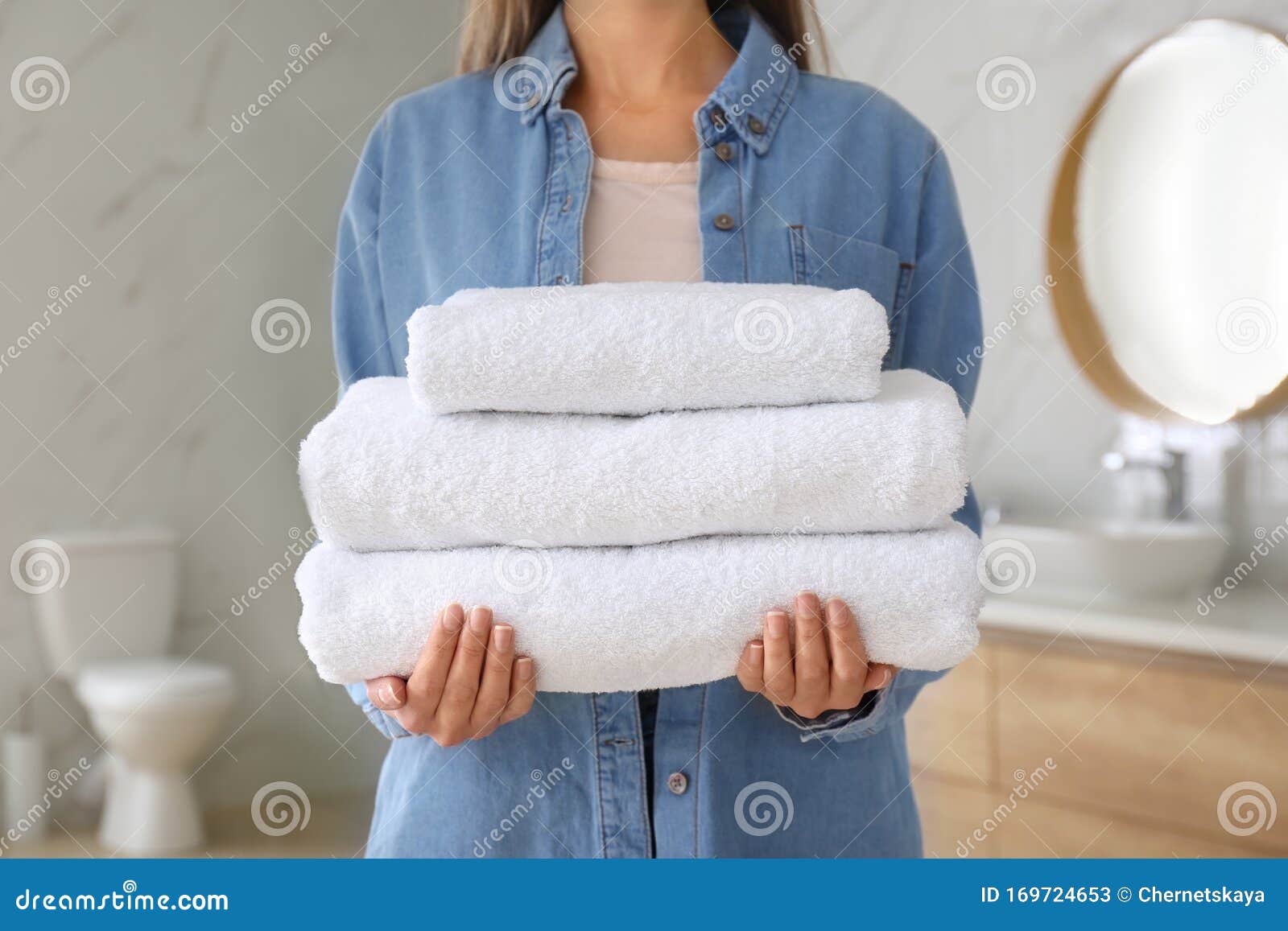 Woman Holding Stack of Fresh Towels Indoors Stock Image - Image of ...
