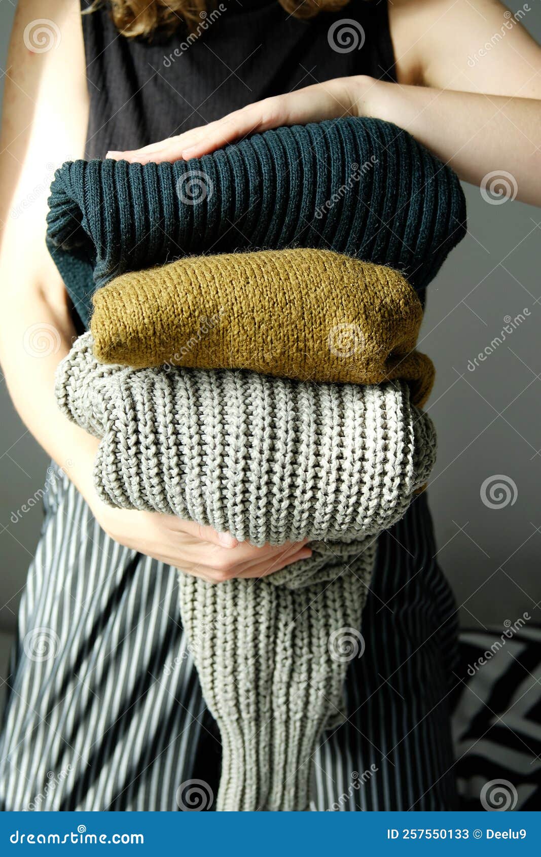 Woman Holding Stack of Warm Wollen Clothes Perparing for Winter Season ...