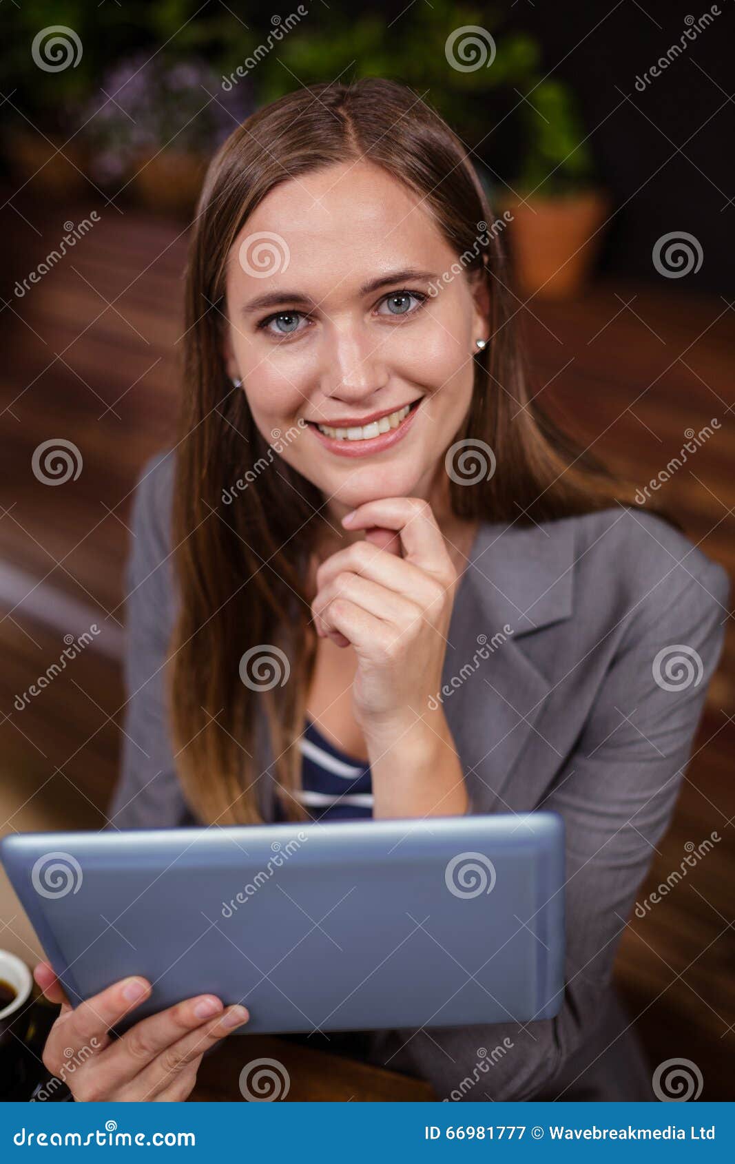 Woman holding a tablet stock image. Image of tablet, retail - 66981777