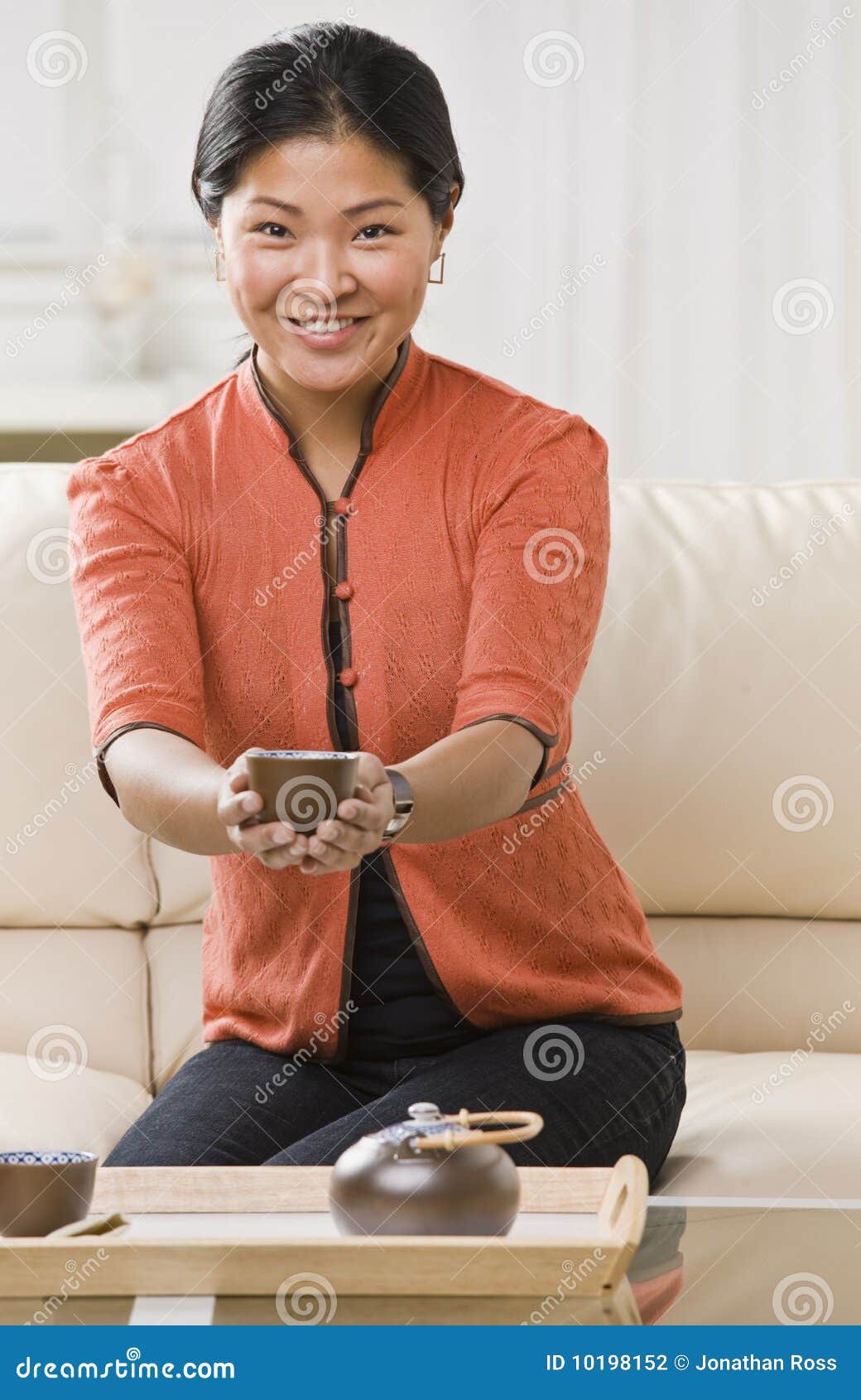Woman Holding Tea stock photo. Image of table, showing - 10198152