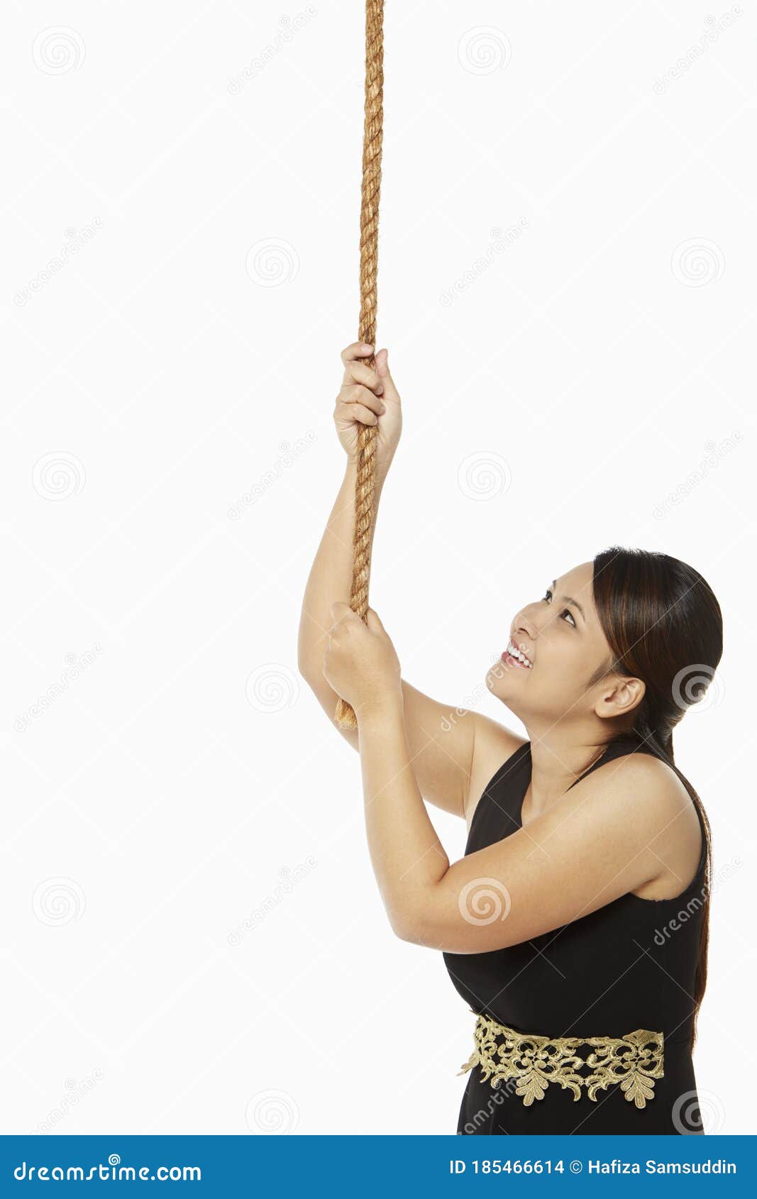 Woman holding on to a rope stock photo. Image of individual - 185466614