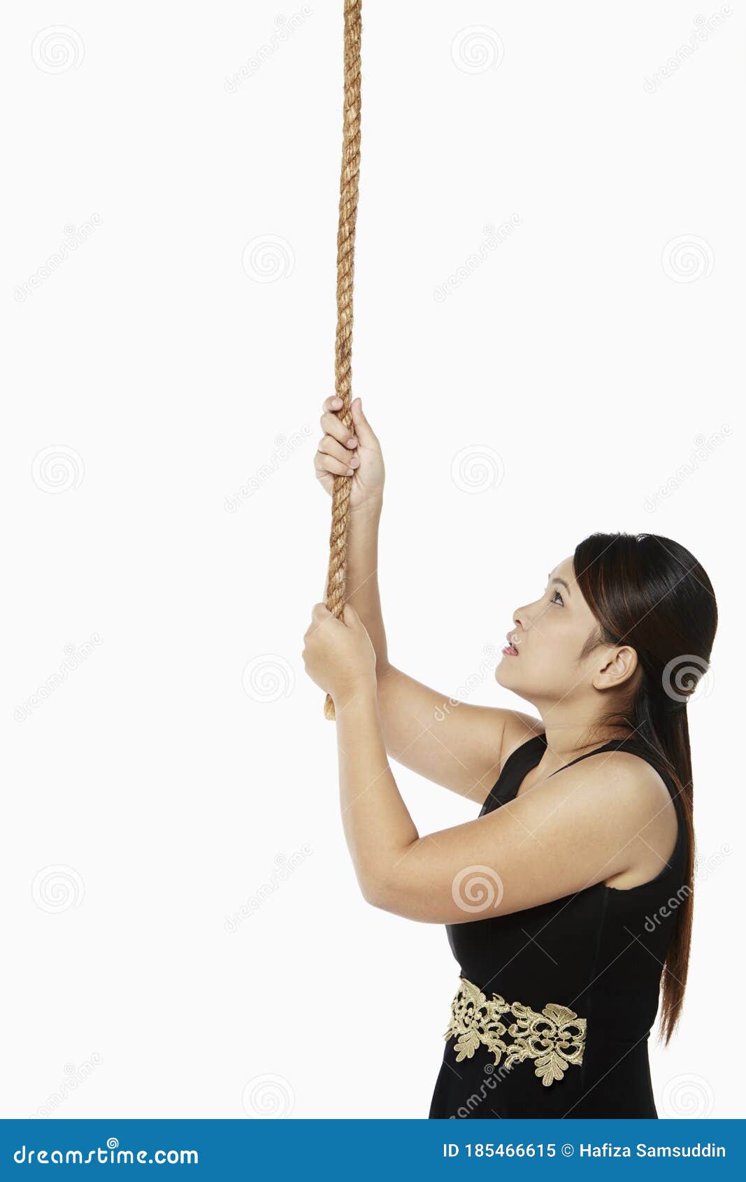 Woman holding on to a rope stock image. Image of standing - 185466615