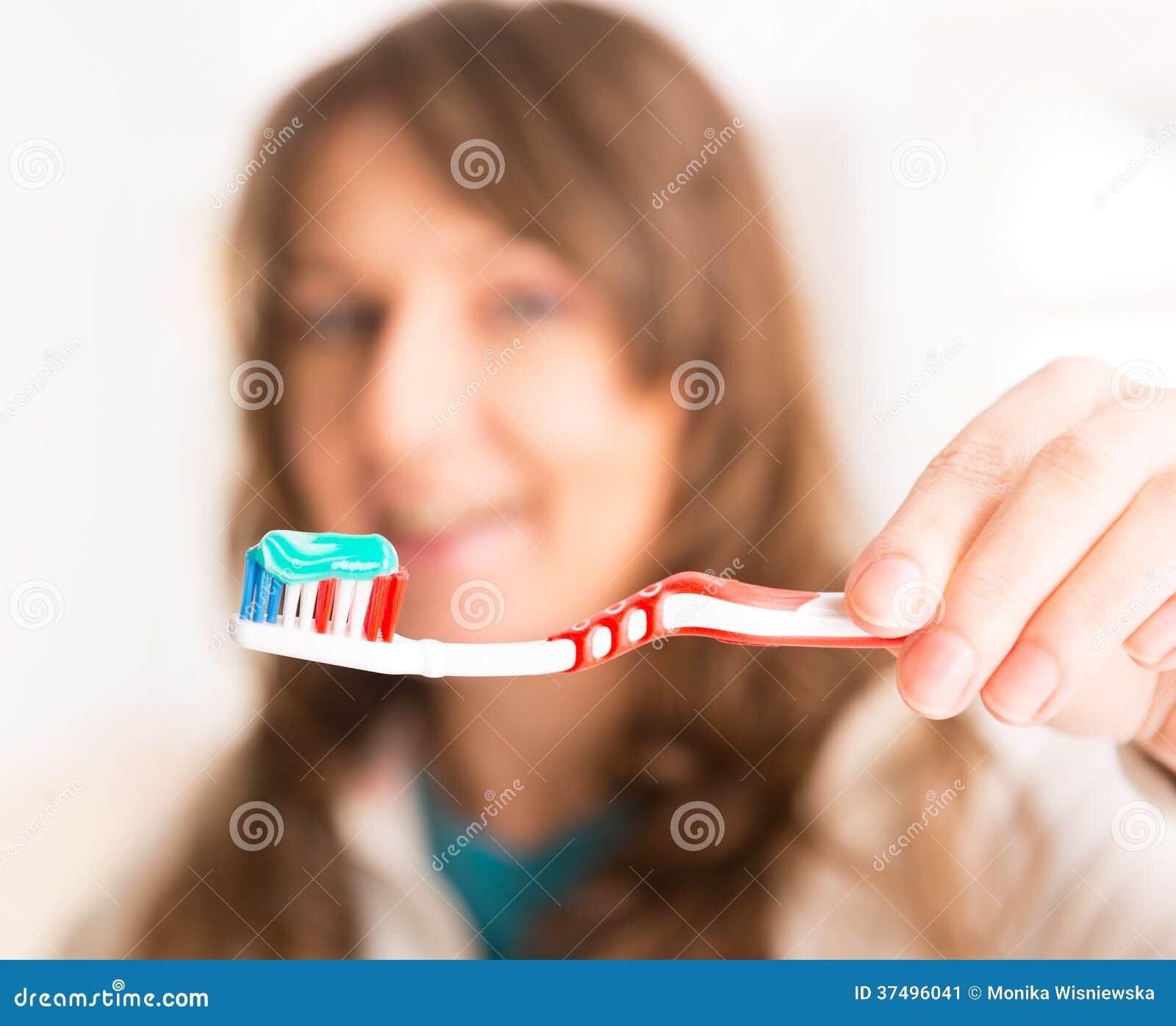 Woman holding toothbrush stock image. Image of model - 37496041