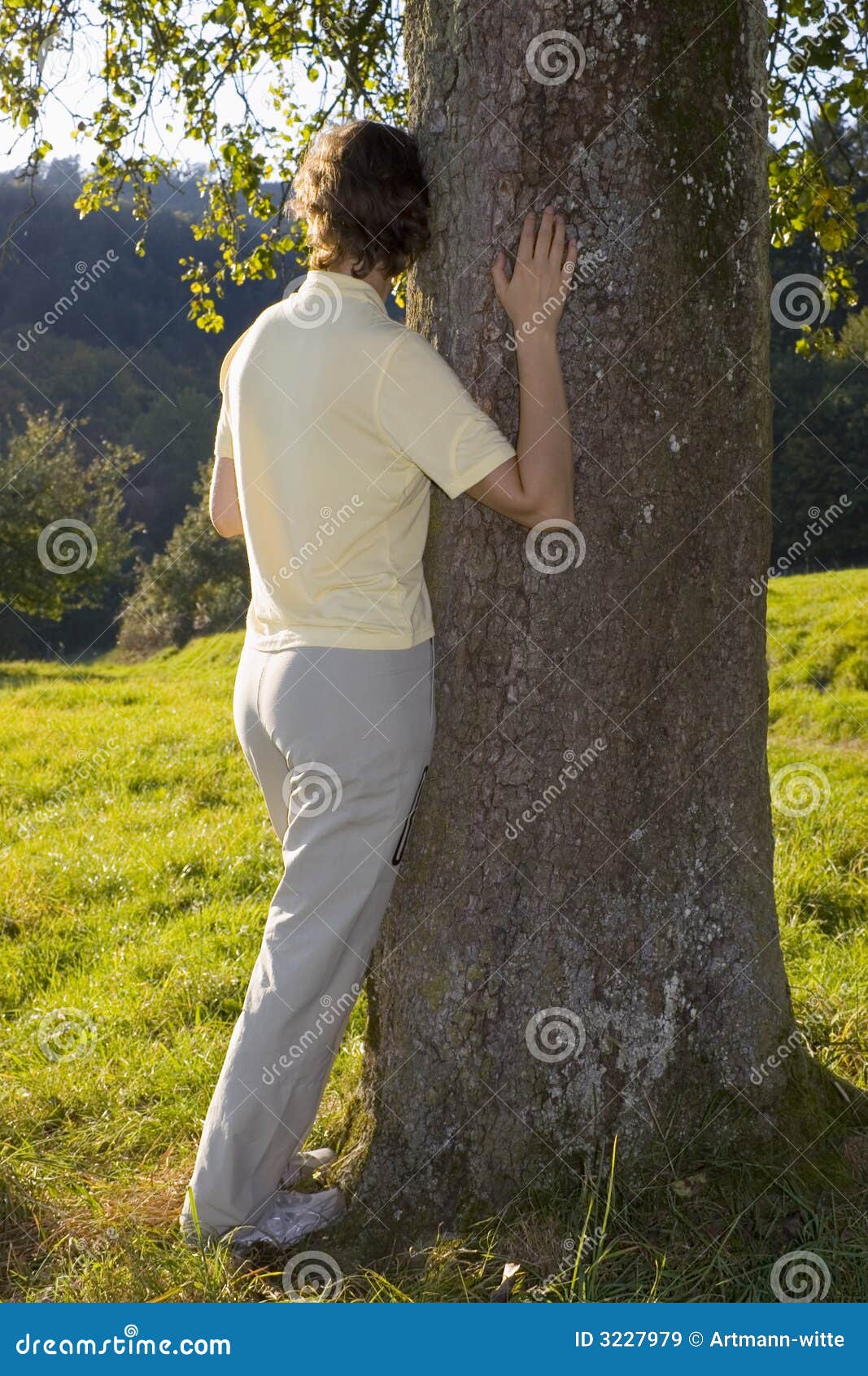 Woman holding a tree stock image. Image of loving, grip - 3227979