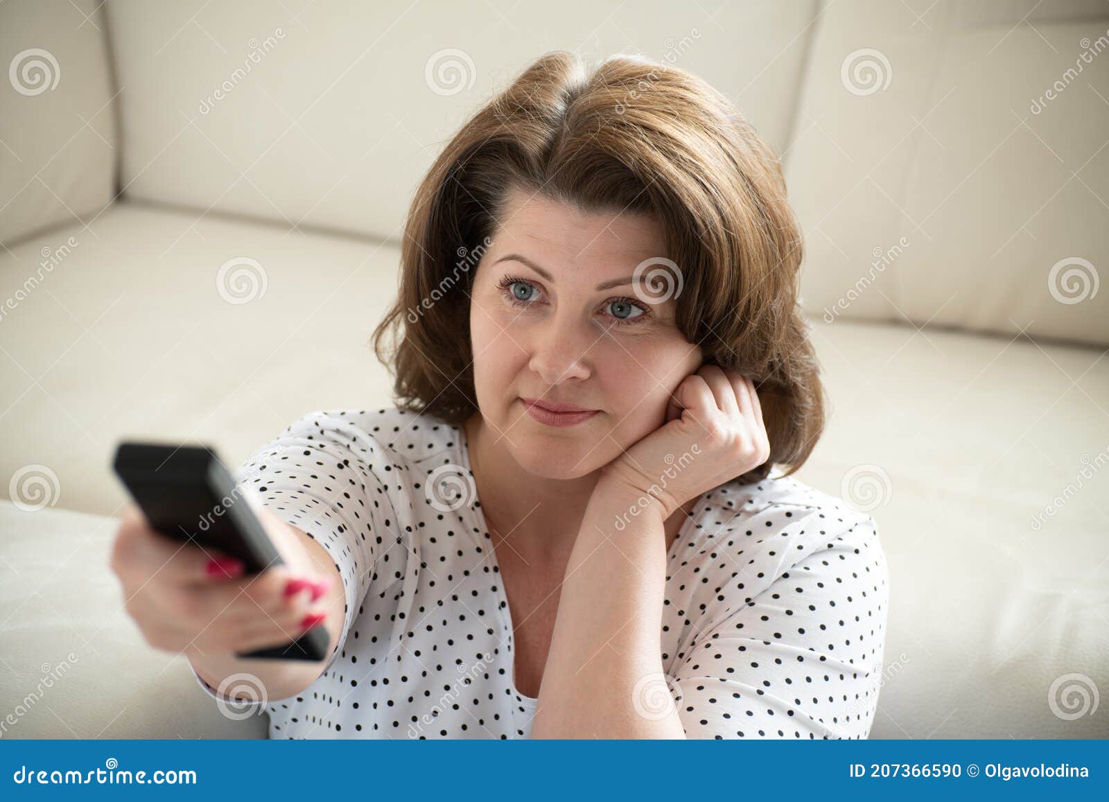 Woman Holding TV Remote Control in Hand Stock Photo - Image of domicile ...