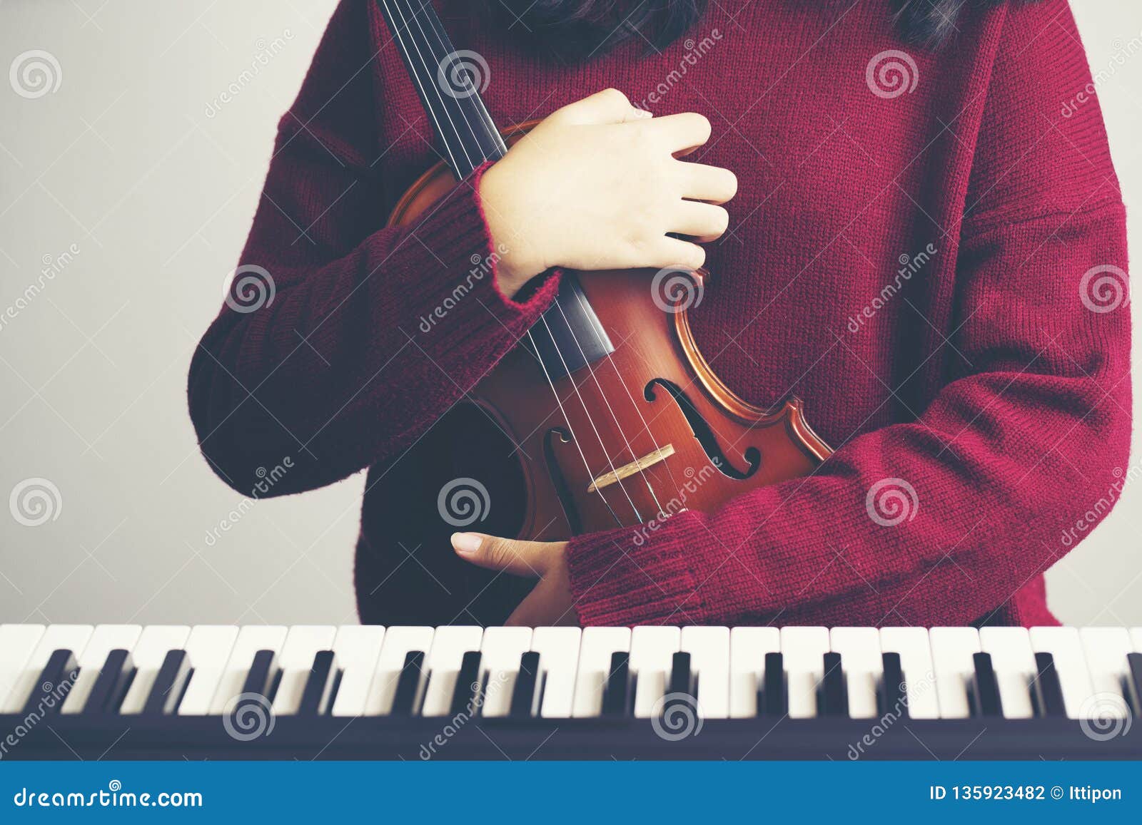 Woman holding violin stock photo. Image of viola, beautiful - 135923482