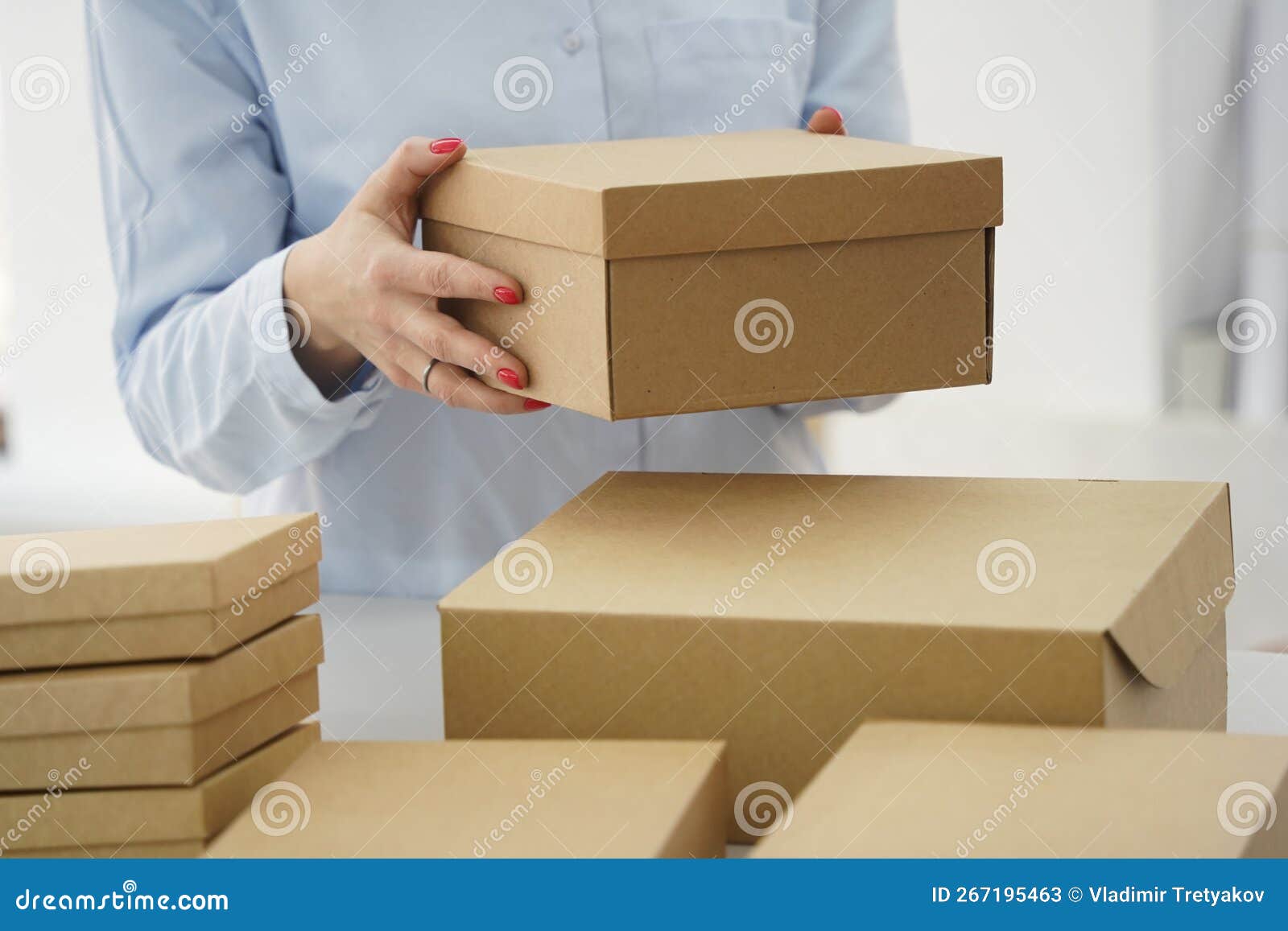 A Woman Holds Cardboard Boxes for Parcels and Delivery Stock Image ...