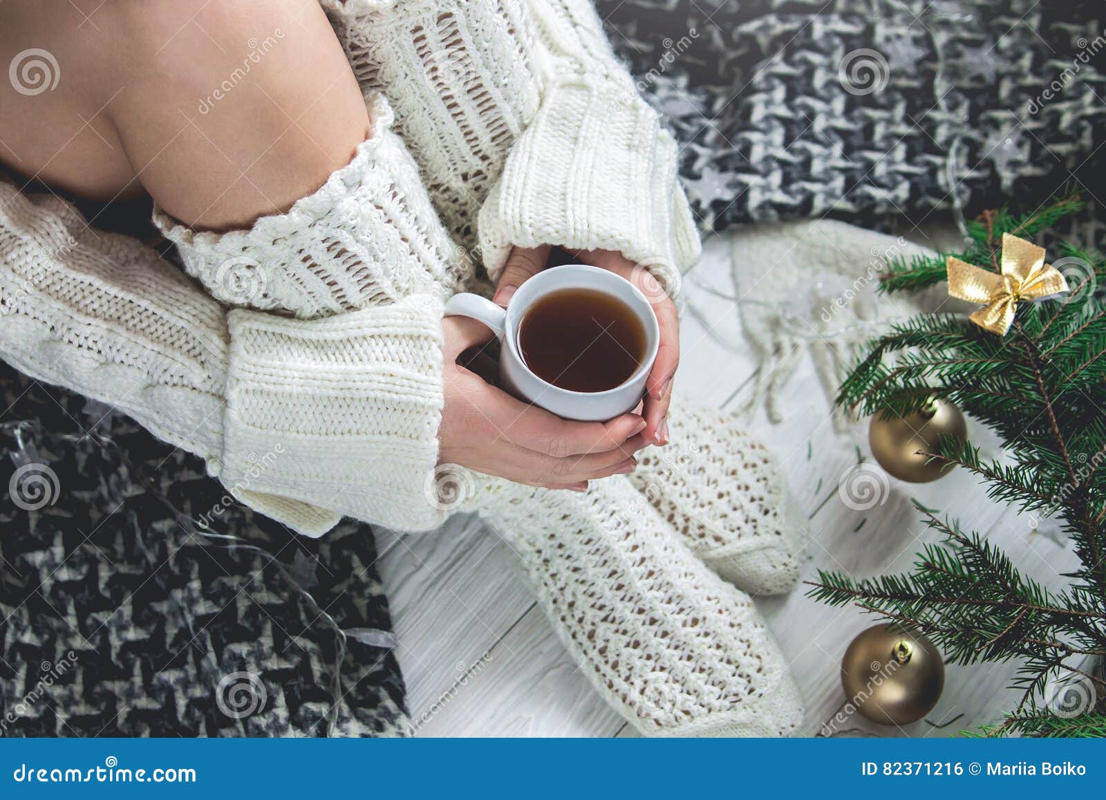Woman Holds a Cup of Tea beside Her Legs Stock Photo - Image of white ...