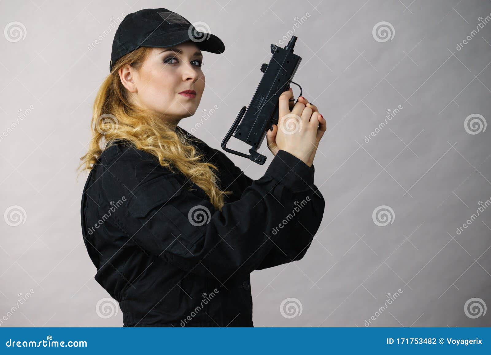 Woman holds gun in hands stock photo. Image of girl - 171753482