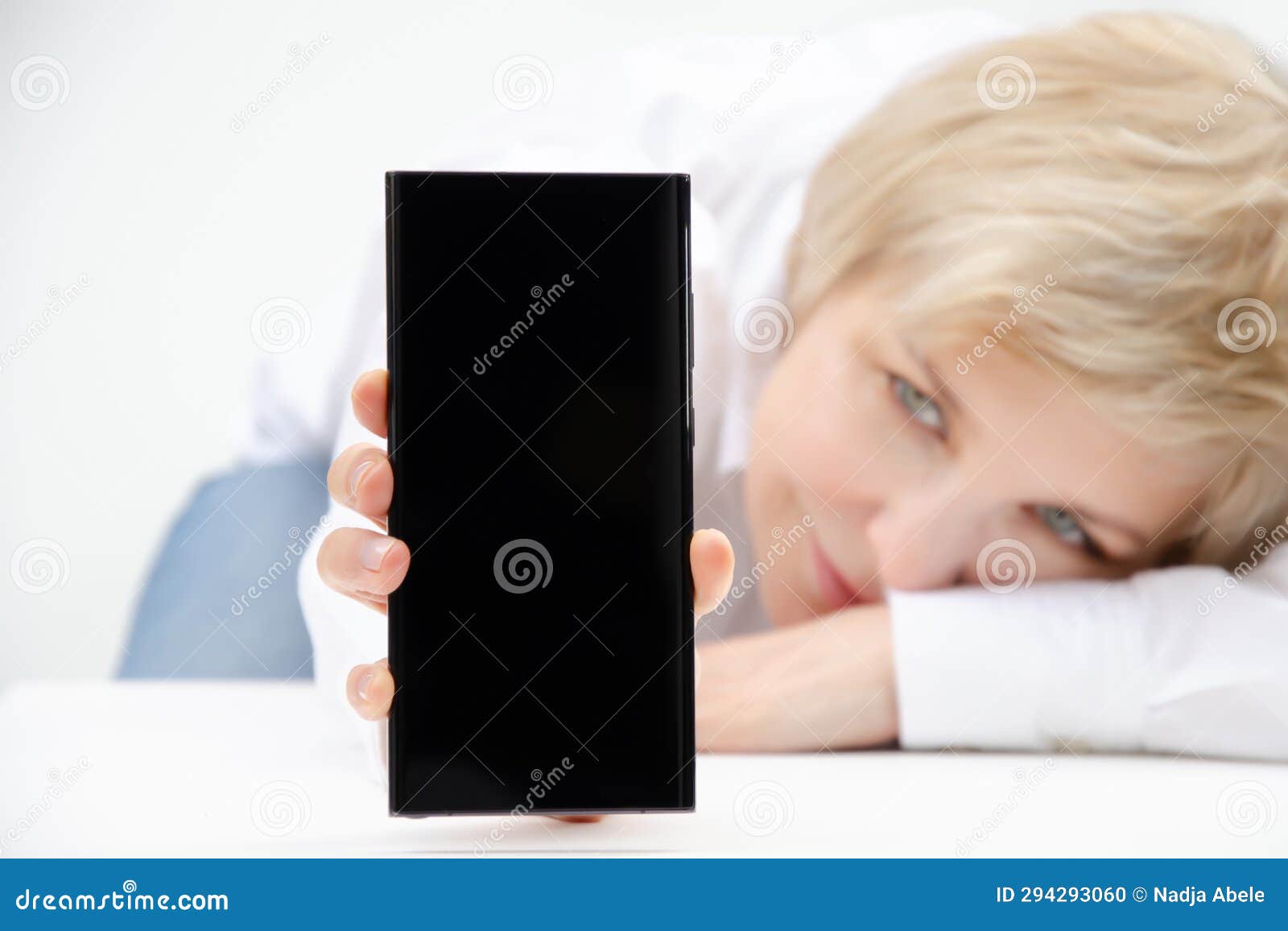 Woman Holds a Smartphone with Screen Facing Forwards. Mock-up. Stock ...