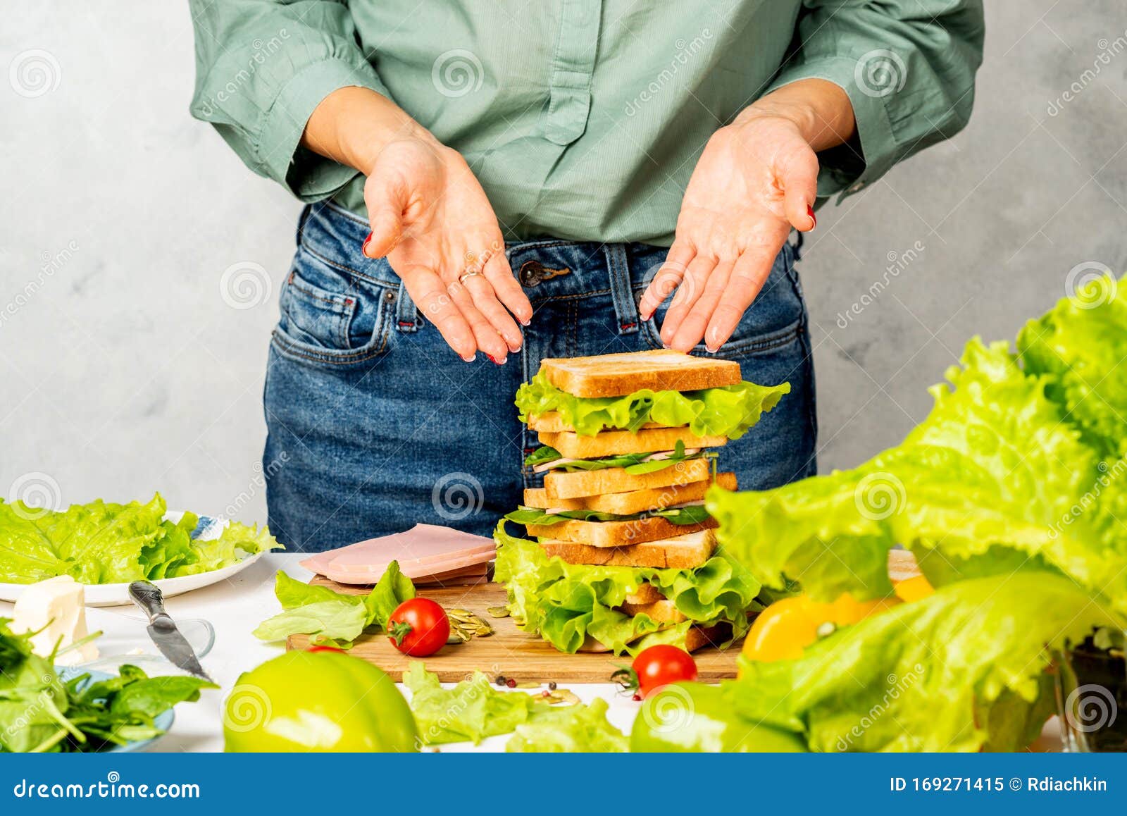 Woman Holds a Stack of Sandwiches in Her Hands on the Kitchen Stock ...