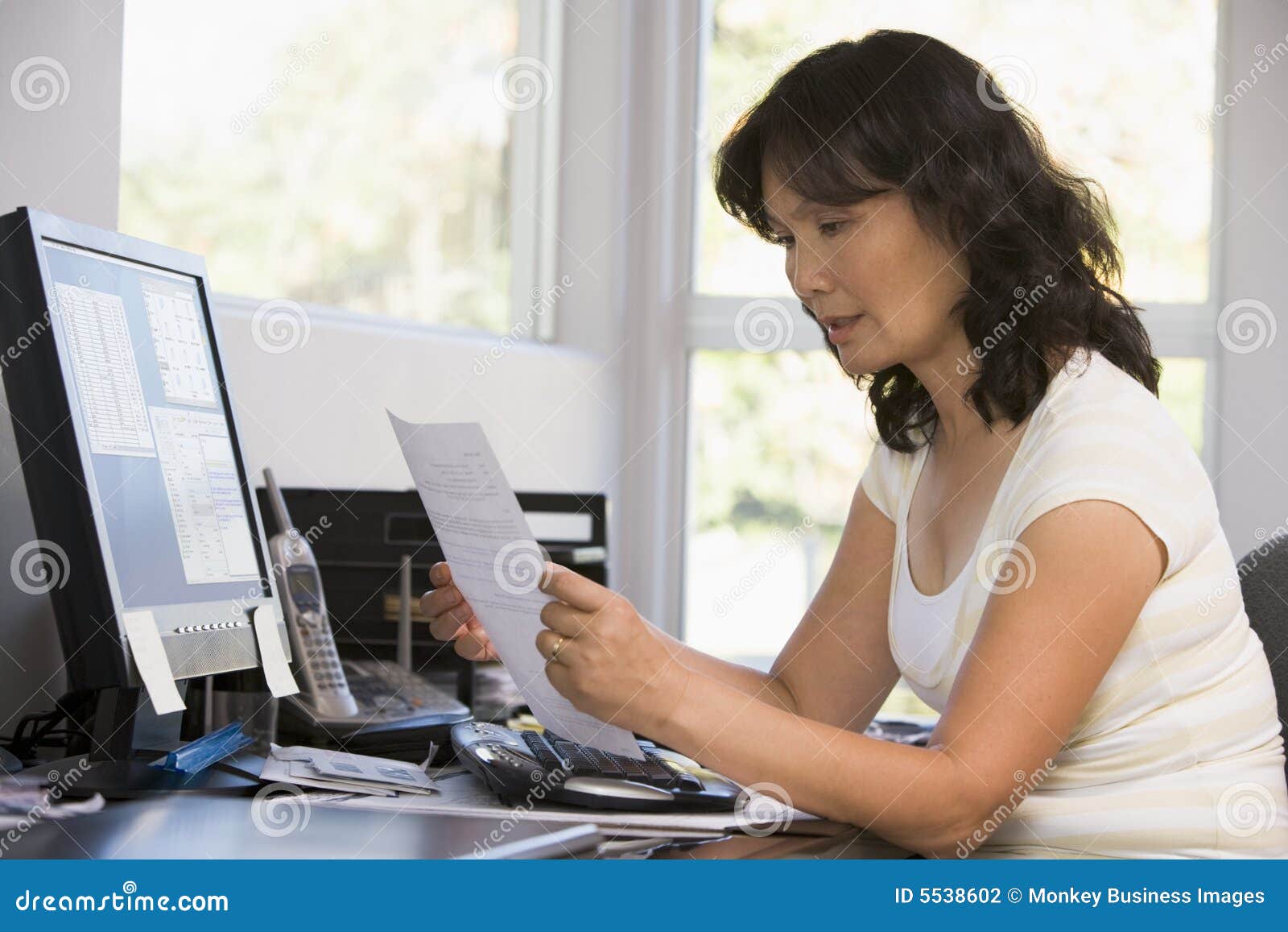 Woman in Home Office with Computer and Paperwork Stock Photo - Image of ...