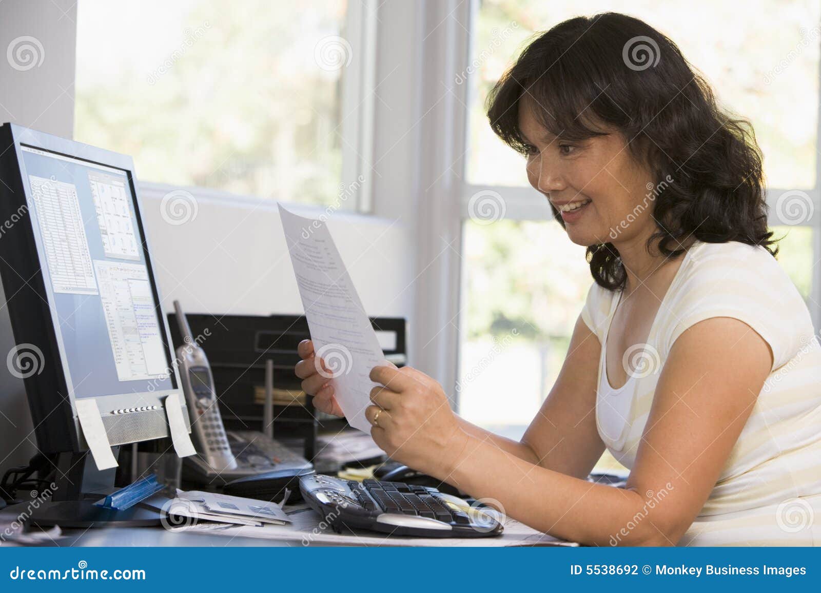 Woman in Home Office with Computer and Paperwork Stock Photo - Image of ...