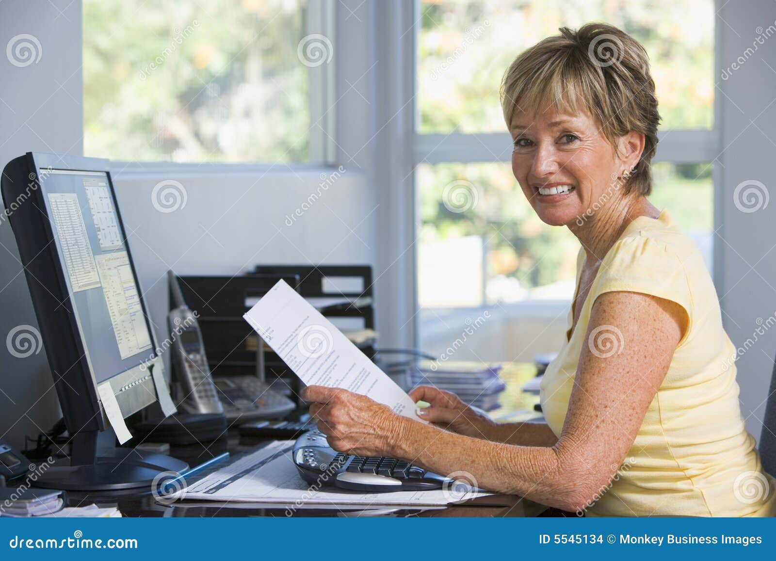 Woman in Home Office with Computer and Paperwork Stock Photo - Image of ...