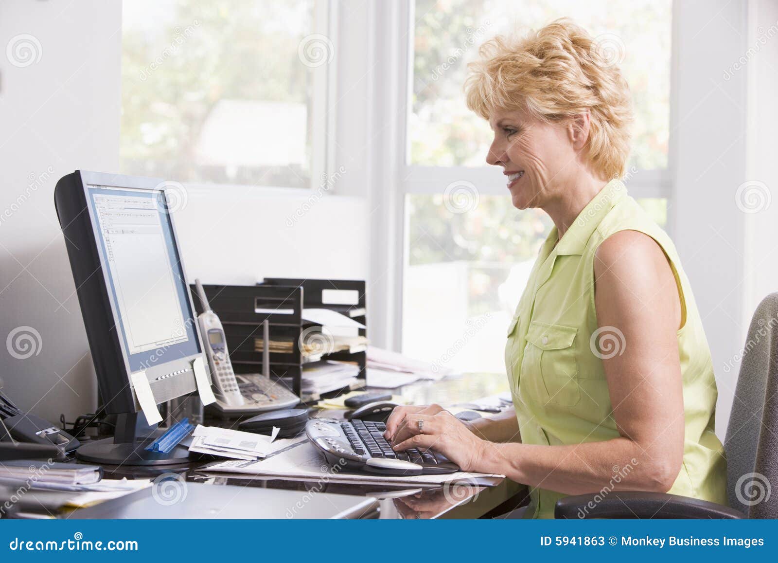 Woman in Home Office at Computer Smiling Stock Image - Image of ...