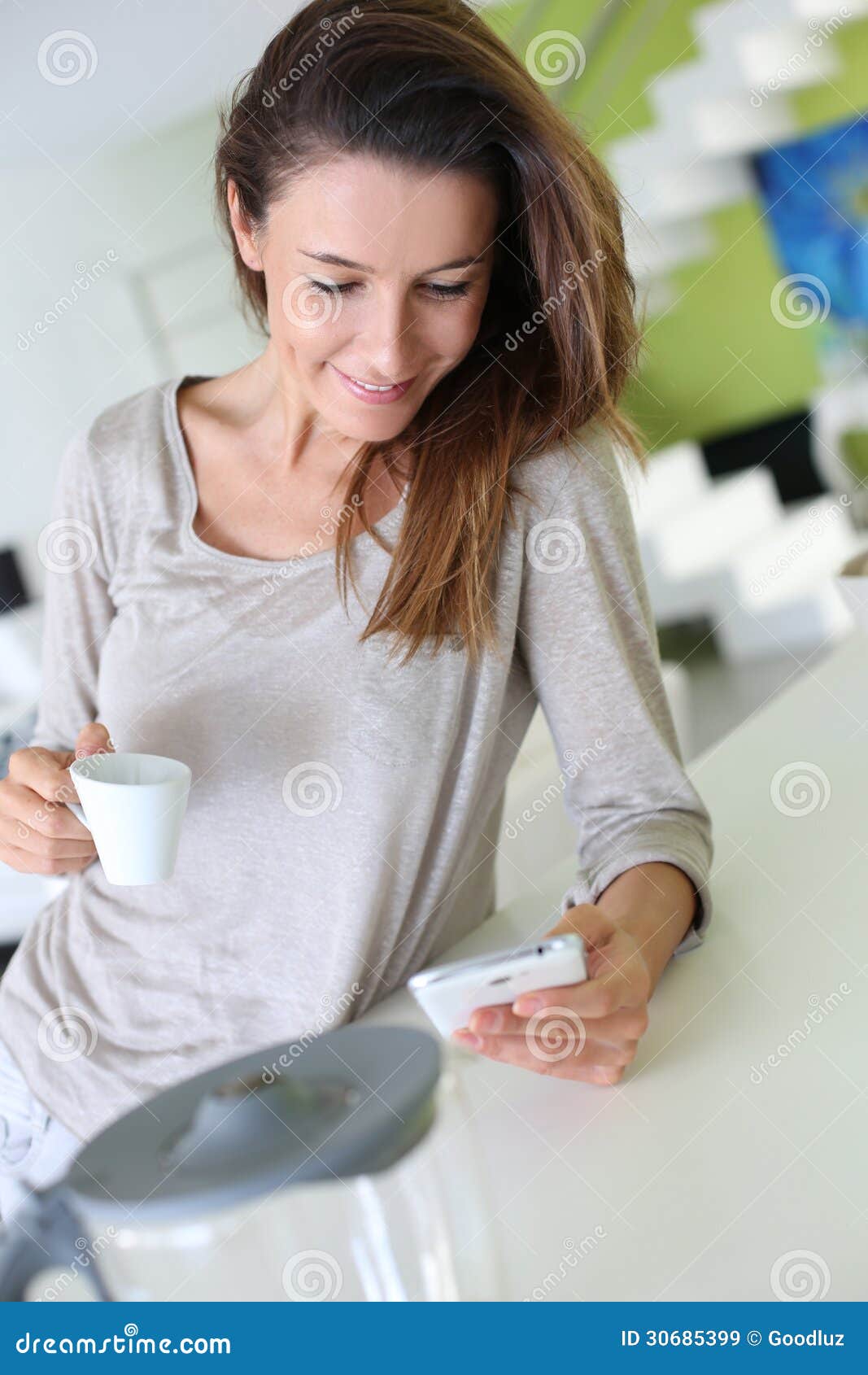 Woman at Home Receiving Message on Smartphone Stock Image - Image of ...