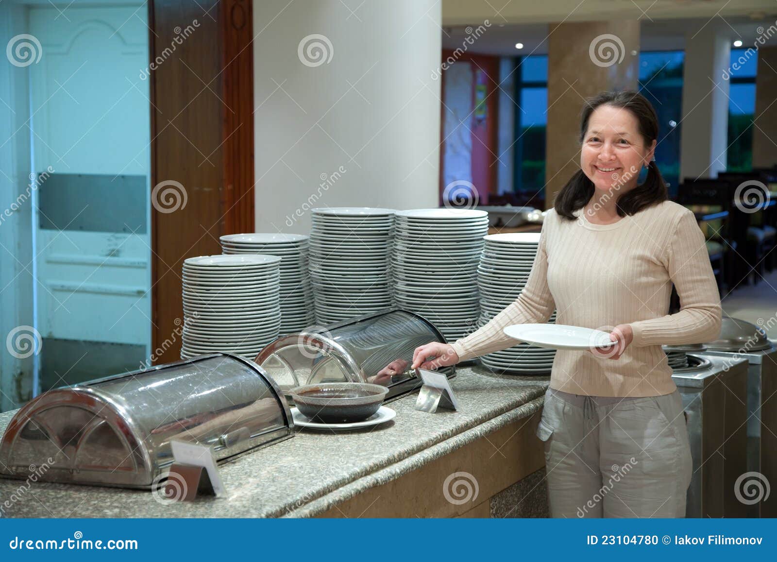 Woman at hotel buffet stock photo. Image of people, dinner - 23104780