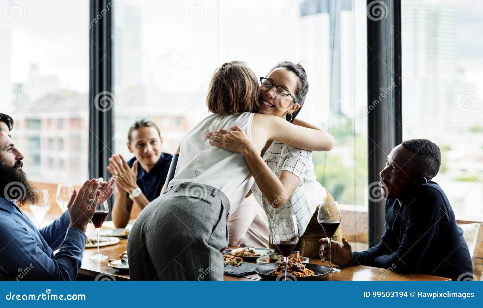 Woman Hugging Each Others at Food Table Stock Photo - Image of hugging ...