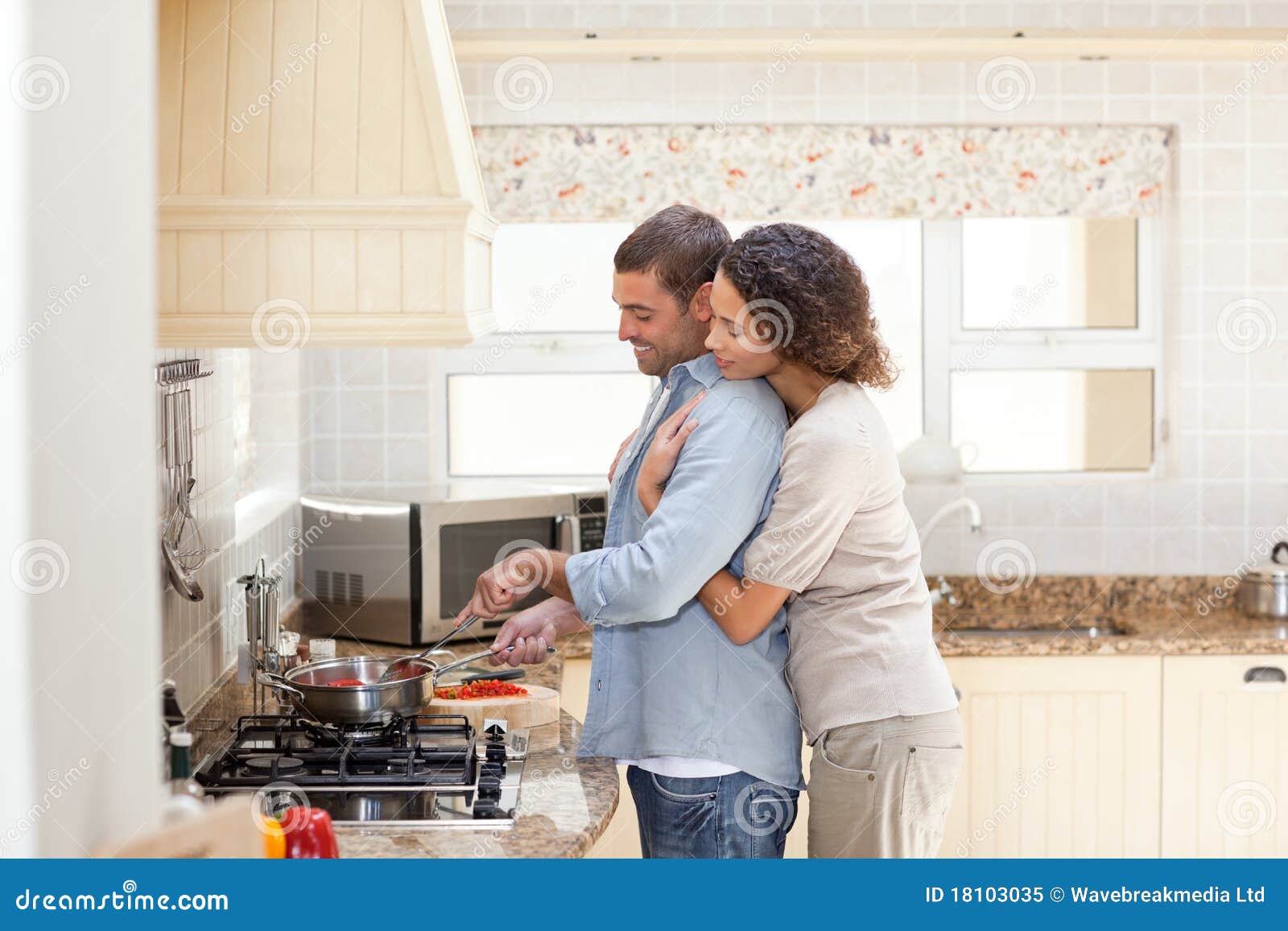 Woman Hugging Her Husband while he is Cooking Stock Image - Image of ...