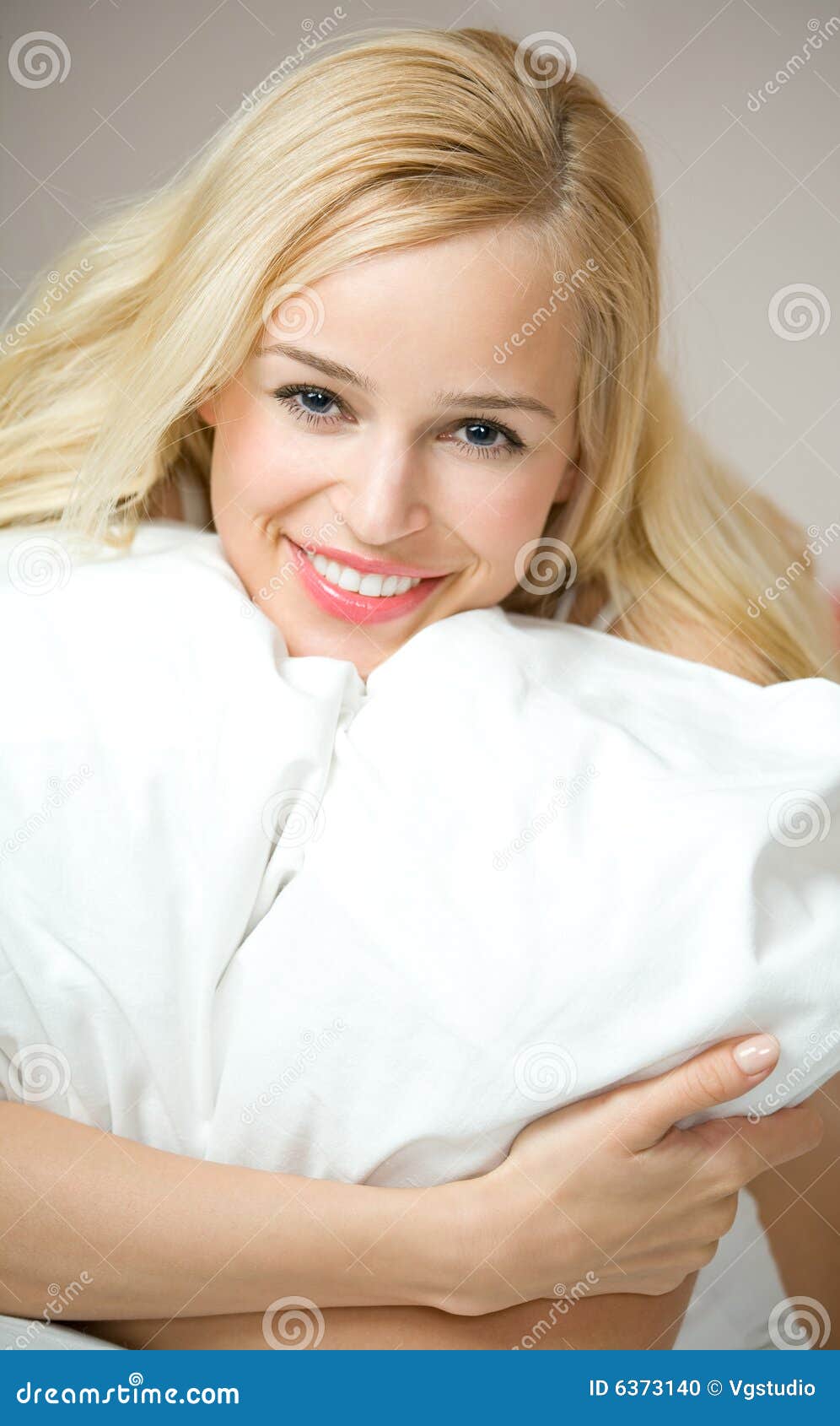 Woman Hugging Pillow on Bed Stock Photo - Image of healthy, people: 6373140