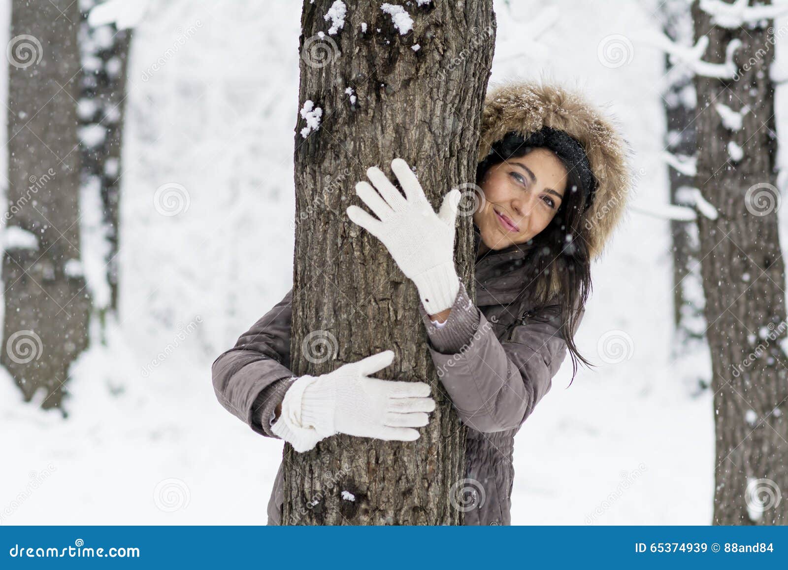 Woman Hugging a Tree in the Winter Forest .loving Nature Stock Image ...