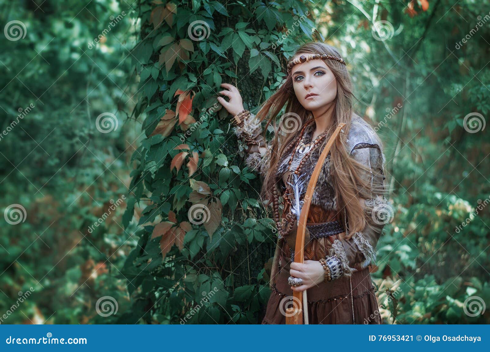 Woman Hunter with a Bow in Hand in the Forest. Amazon Stock Image ...
