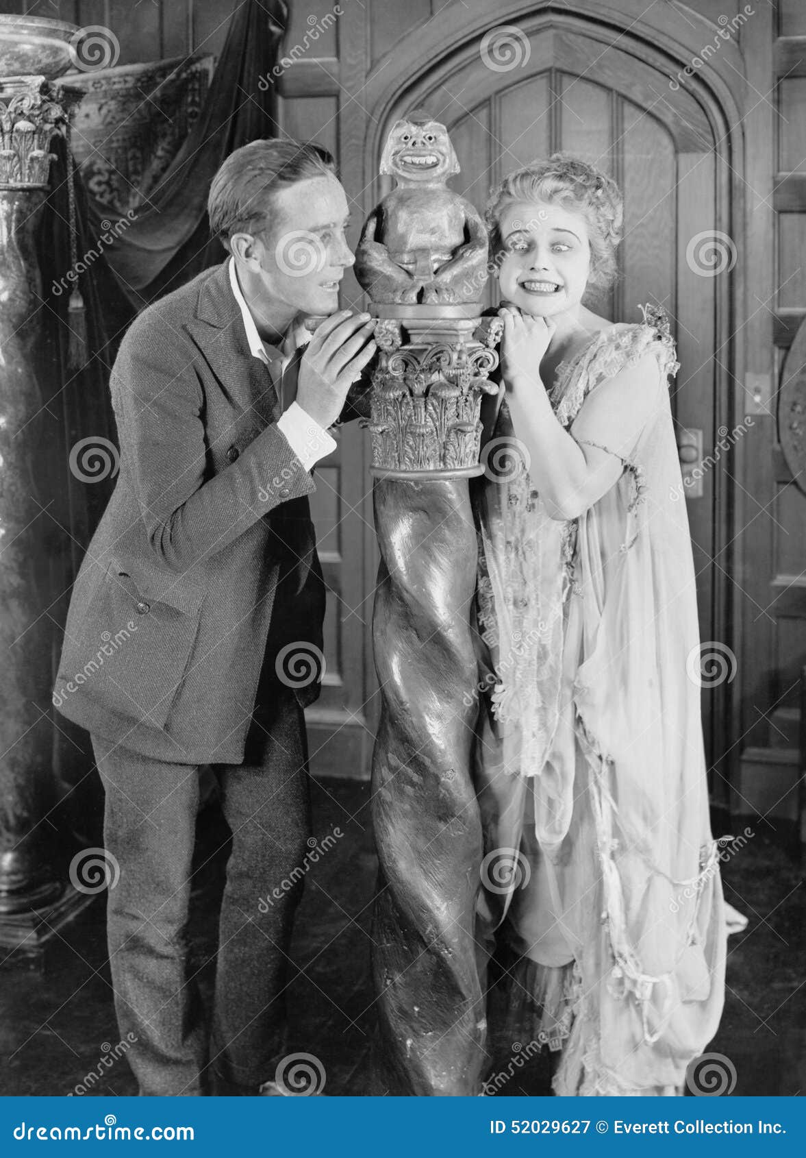 Woman Imitating The Facial Expression Of A Monkey Statue Royalty-Free ...