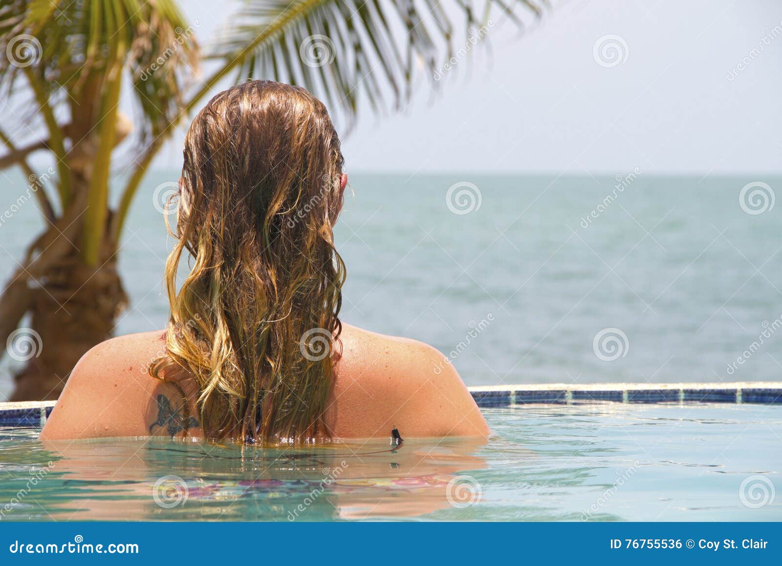 Woman in an Infinity Pool beside Ocean Stock Photo - Image of water ...