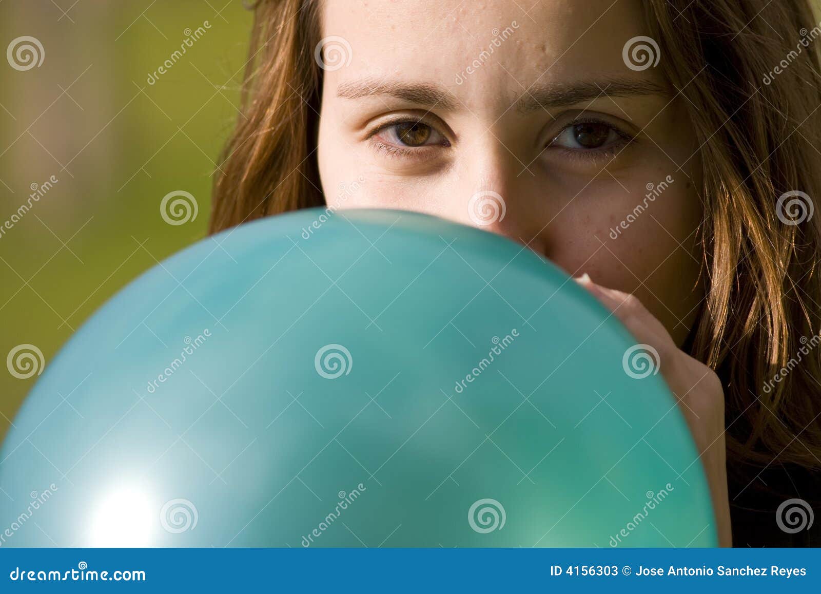 Woman Inflating Blue Balloon Stock Image - Image: 4156303