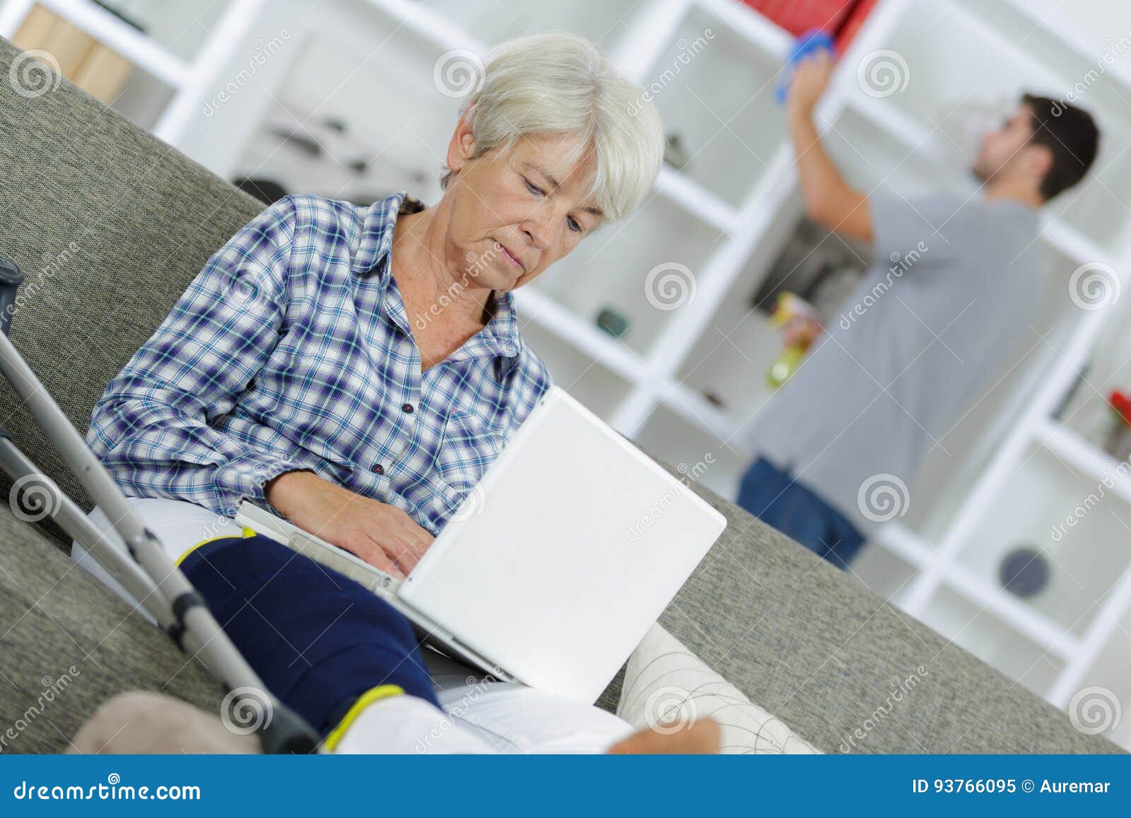 Woman with Injured Leg Using Laptop Stock Image - Image of home, pain ...