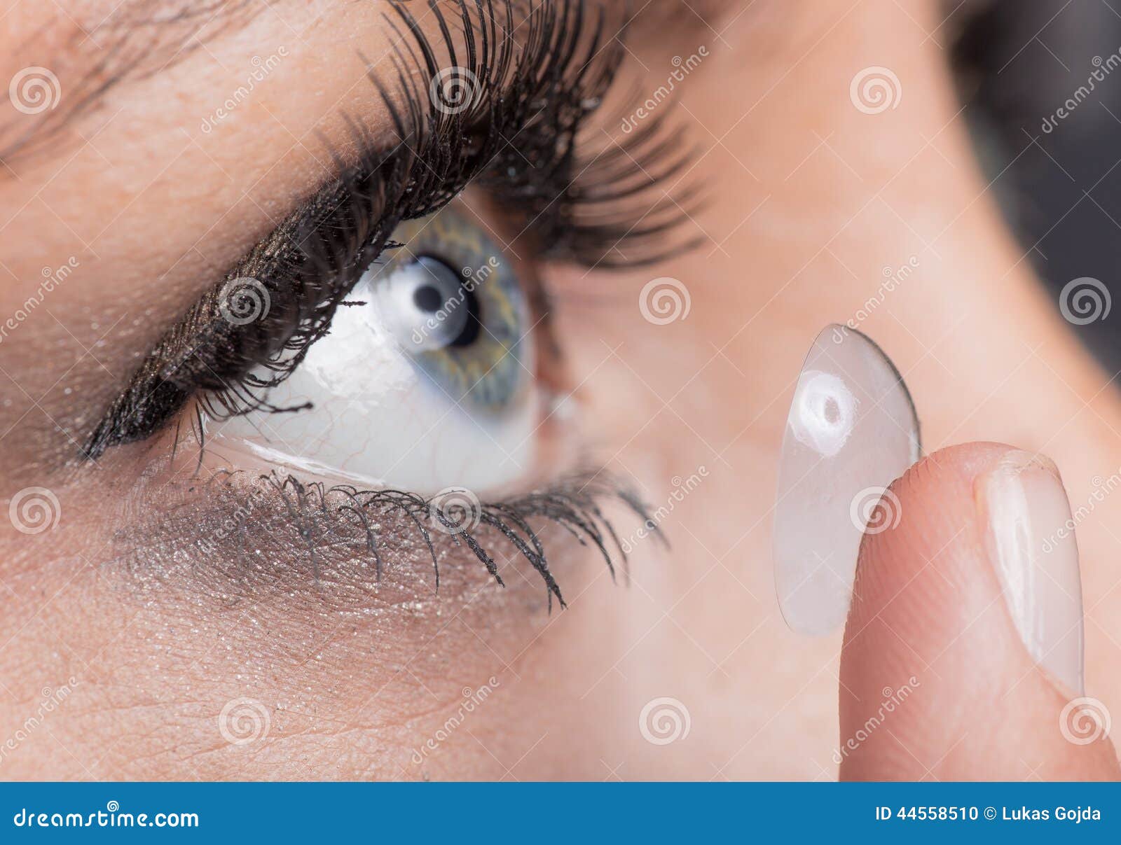 Woman Inserting a Contact Lens Stock Photo - Image of lashes, beauty ...
