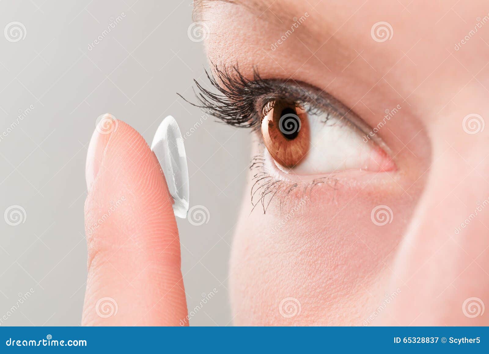 Woman Inserting a Contact Lens in Eye. Stock Image - Image of ...