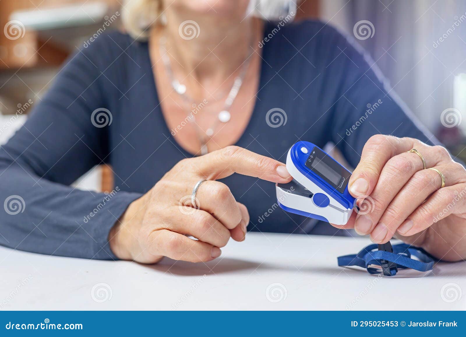Woman is Inserting Finger into Electronic Pulse Oximeter Stock Image ...