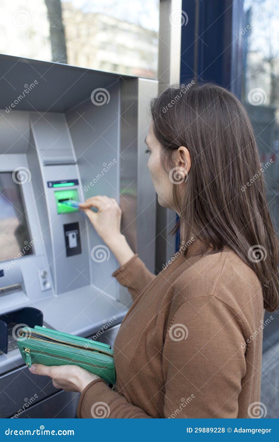 Woman Putting Card into ATM in Spring Stock Photo - Image of standing ...