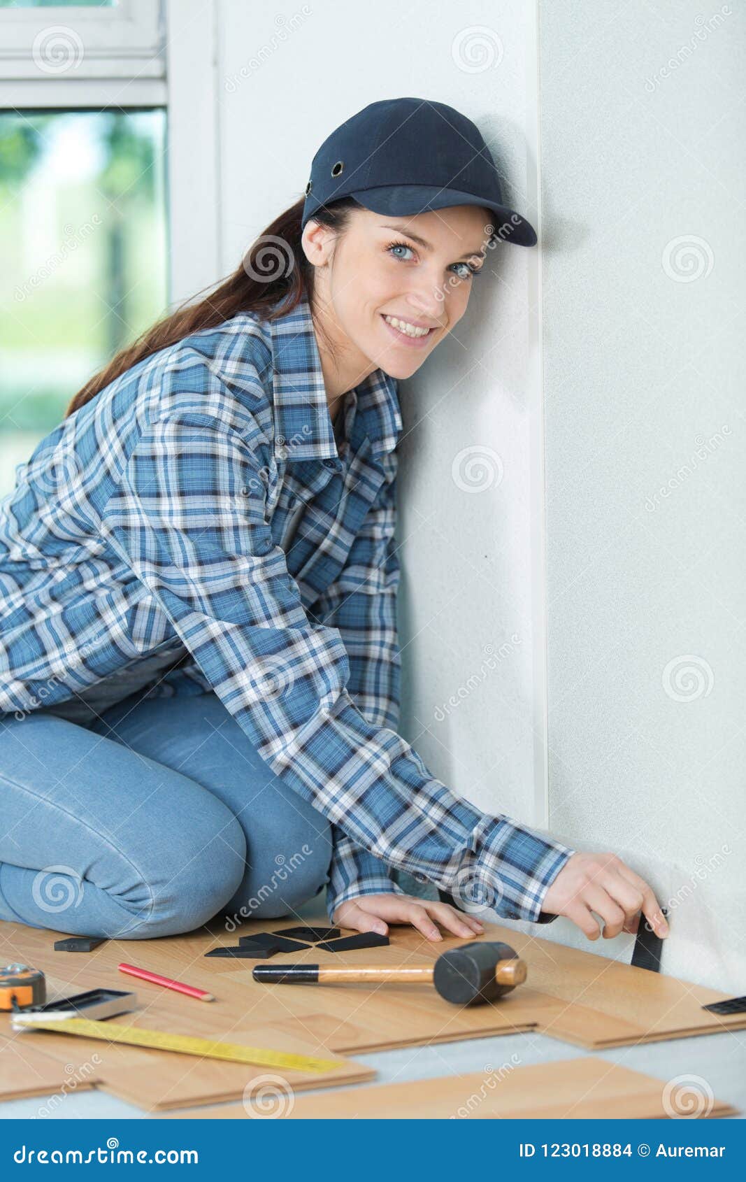 Woman Installing Laminated Flooring Stock Photo - Image of precision ...