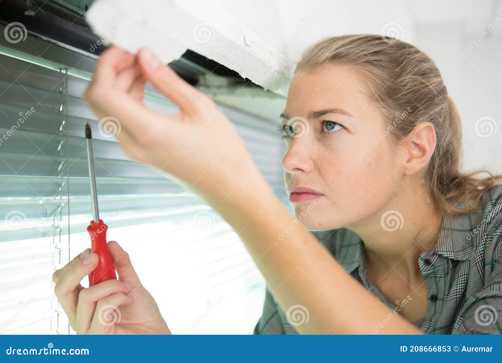 Woman installing window stock image. Image of home, installing - 208666853