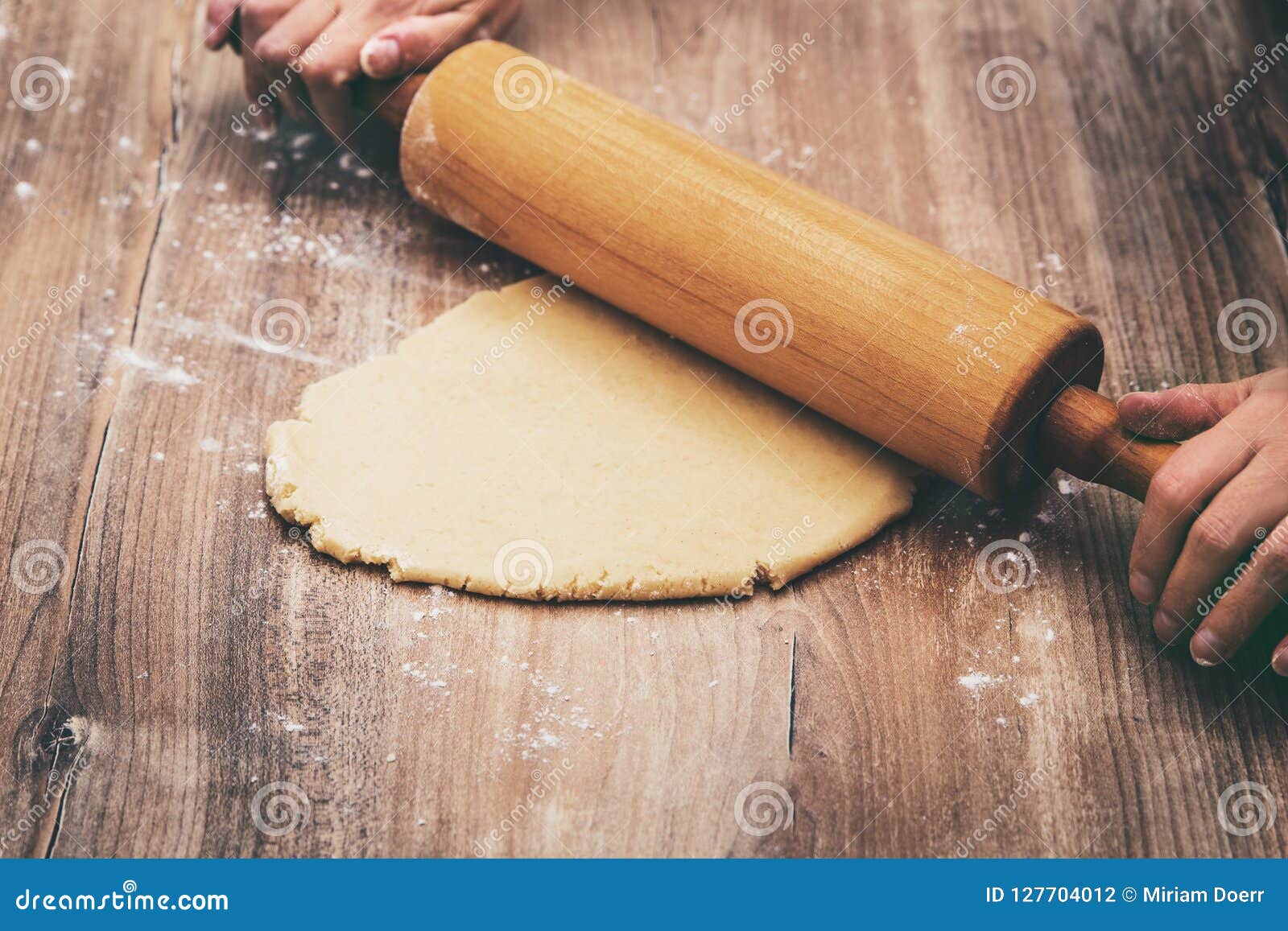 Woman Ist Rolling Raw Cookie Dough with a Rolling Pin Stock Photo ...