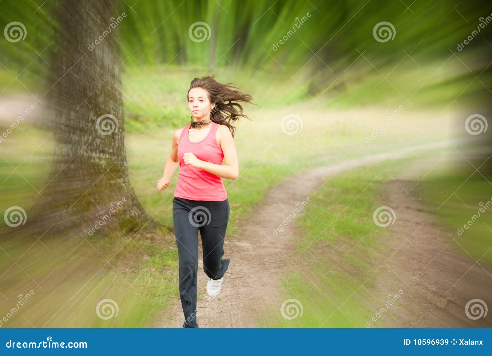 Woman Jogging through a Forest Stock Image - Image of happy, exercise ...