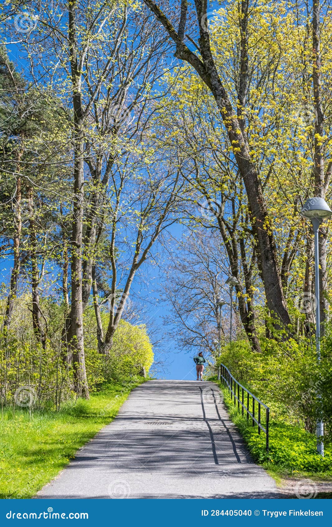 Woman Jogging Up a Steep Hill in Spring.. Stock Photo - Image of ...