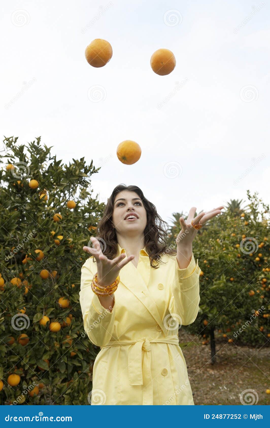 Woman Juggling Oranges stock photo. Image of concept - 24877252