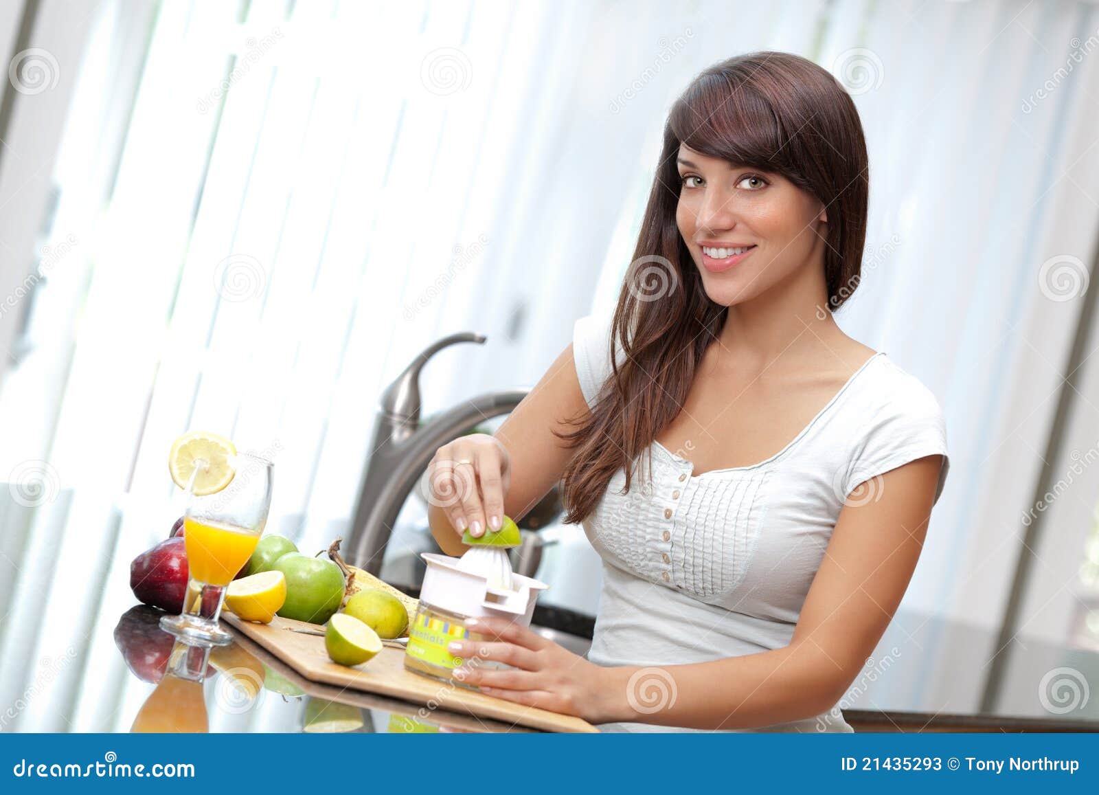 Woman juicing lime stock image. Image of orange, smiling - 21435293