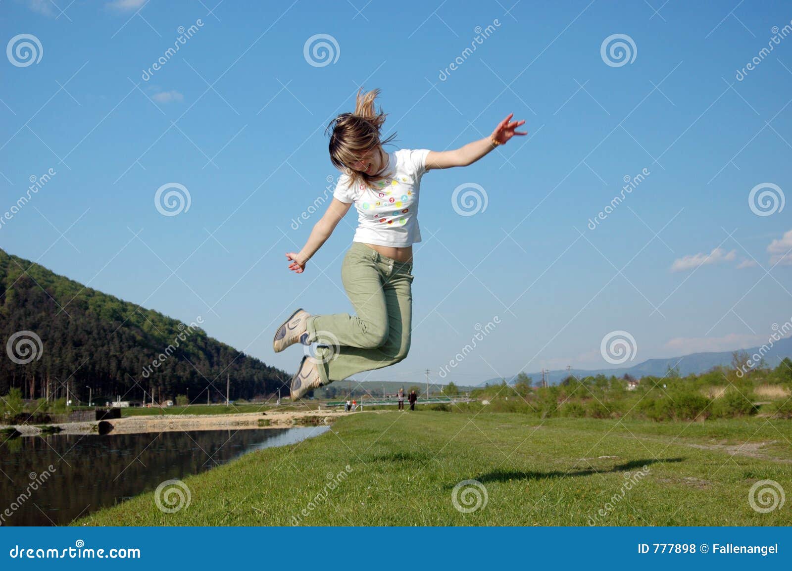 Woman jump stock photo. Image of jump, clouds, lake, business - 777898
