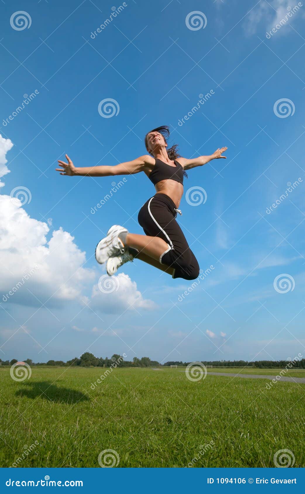Woman jumping stock photo. Image of people, blue, copy - 1094106