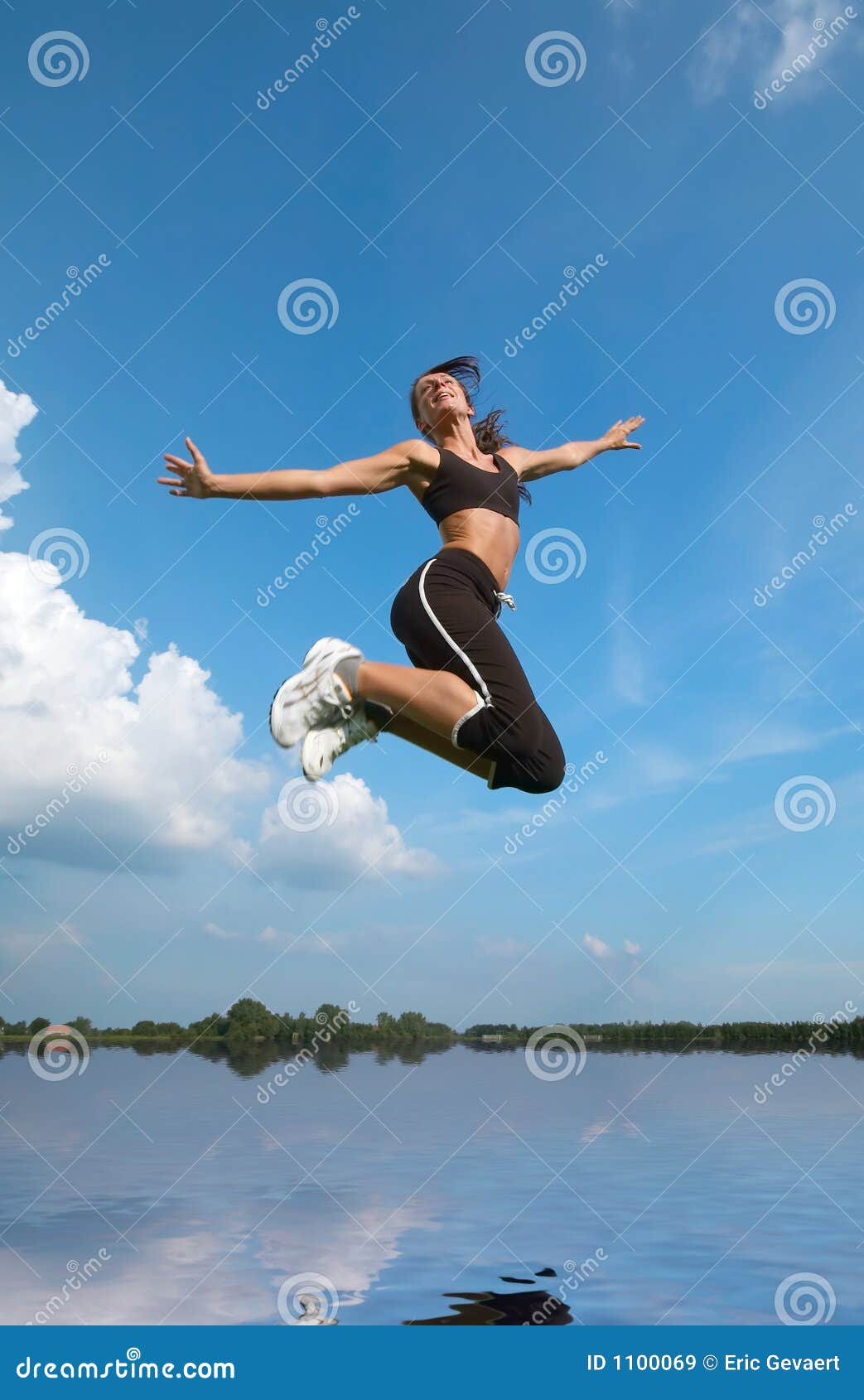Woman jumping above water stock image. Image of girl, excited - 1100069