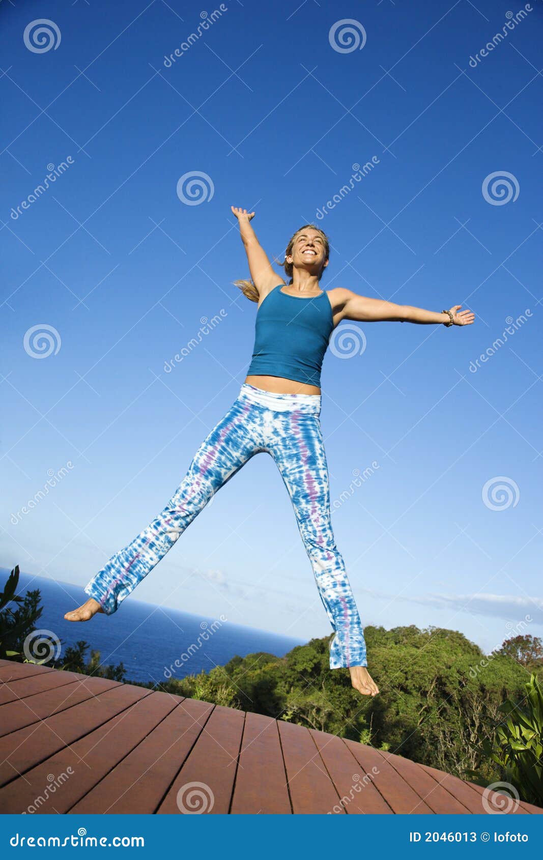 Woman jumping into air. stock image. Image of jumping - 2046013