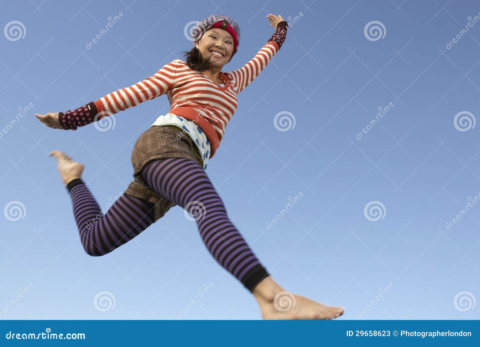 Woman Jumping with Arms Outstretched Stock Image - Image of excited ...