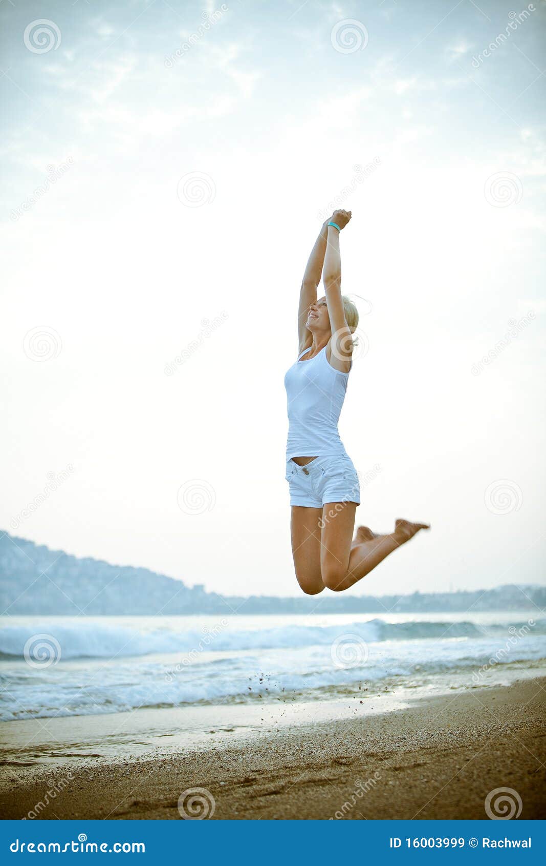 Woman jumping on the beach stock image. Image of person - 16003999