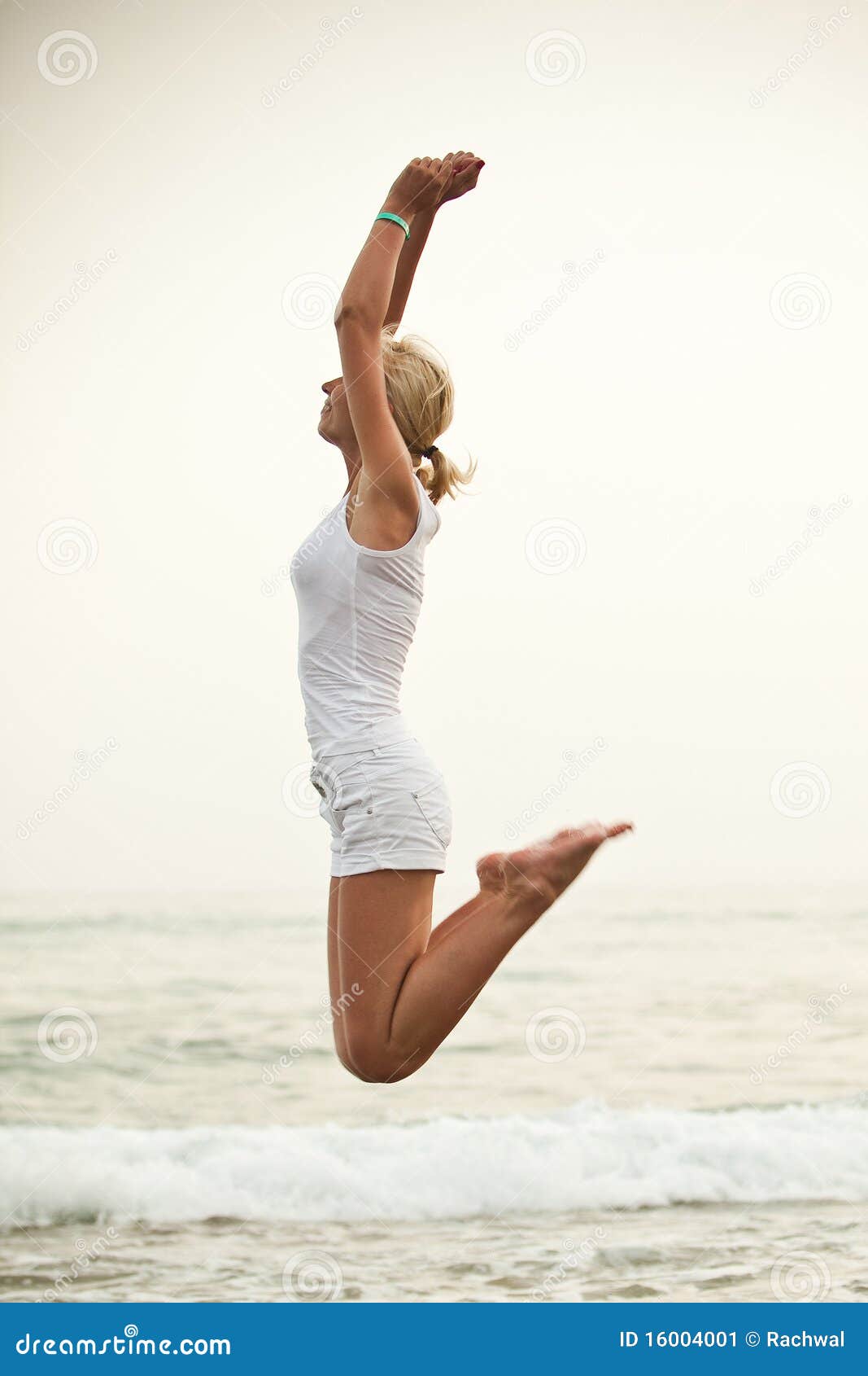 Woman jumping on the beach stock image. Image of cheerful - 16004001